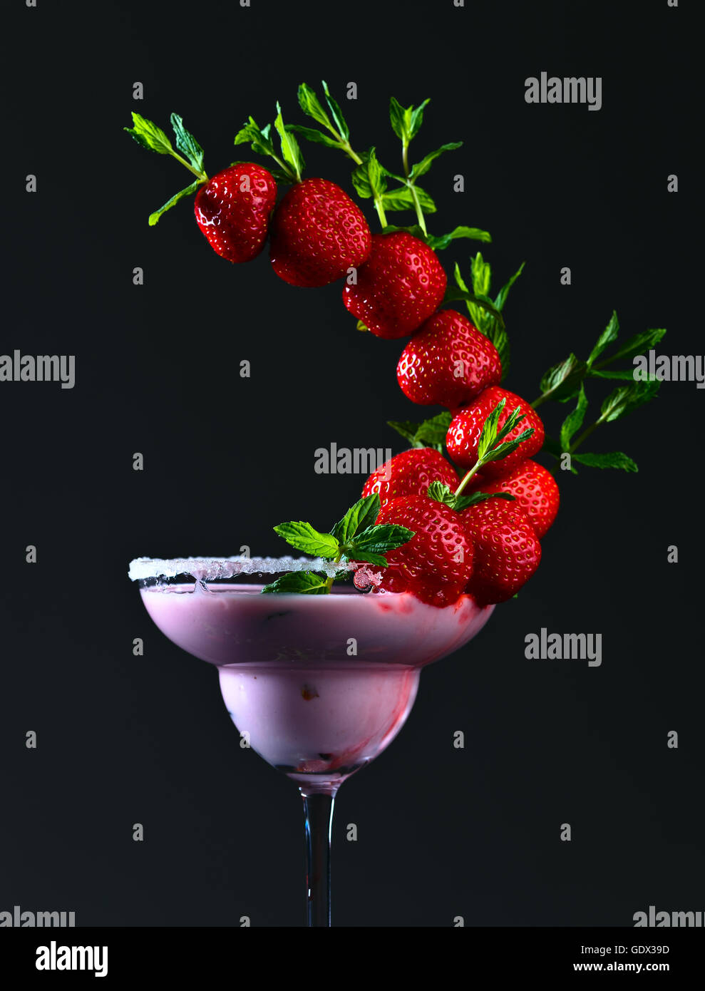 strawberry cocktail with berries and peppermint leaves Stock Photo - Alamy
