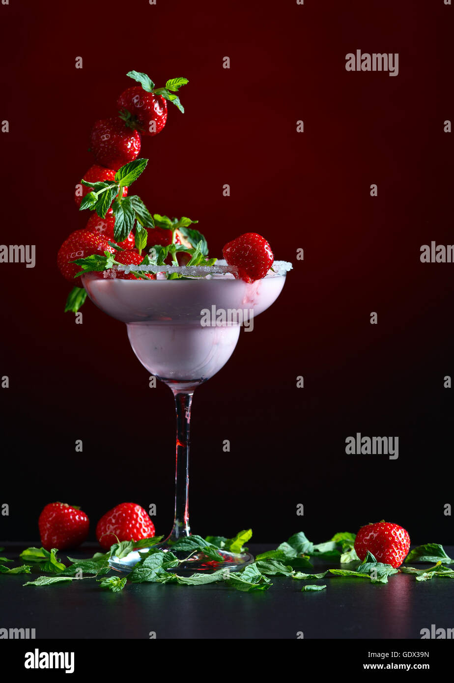 strawberry cocktail with berries and peppermint leaves Stock Photo - Alamy