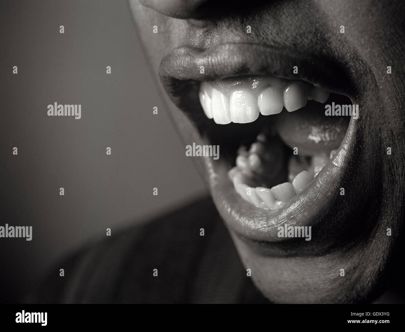 Closeup of man screaming or yelling with a wide mouth Stock Photo - Alamy