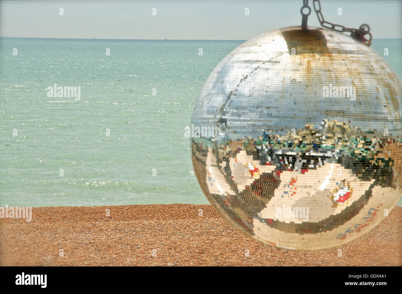 Reflections in a ball on Brighton beach Stock Photo - Alamy