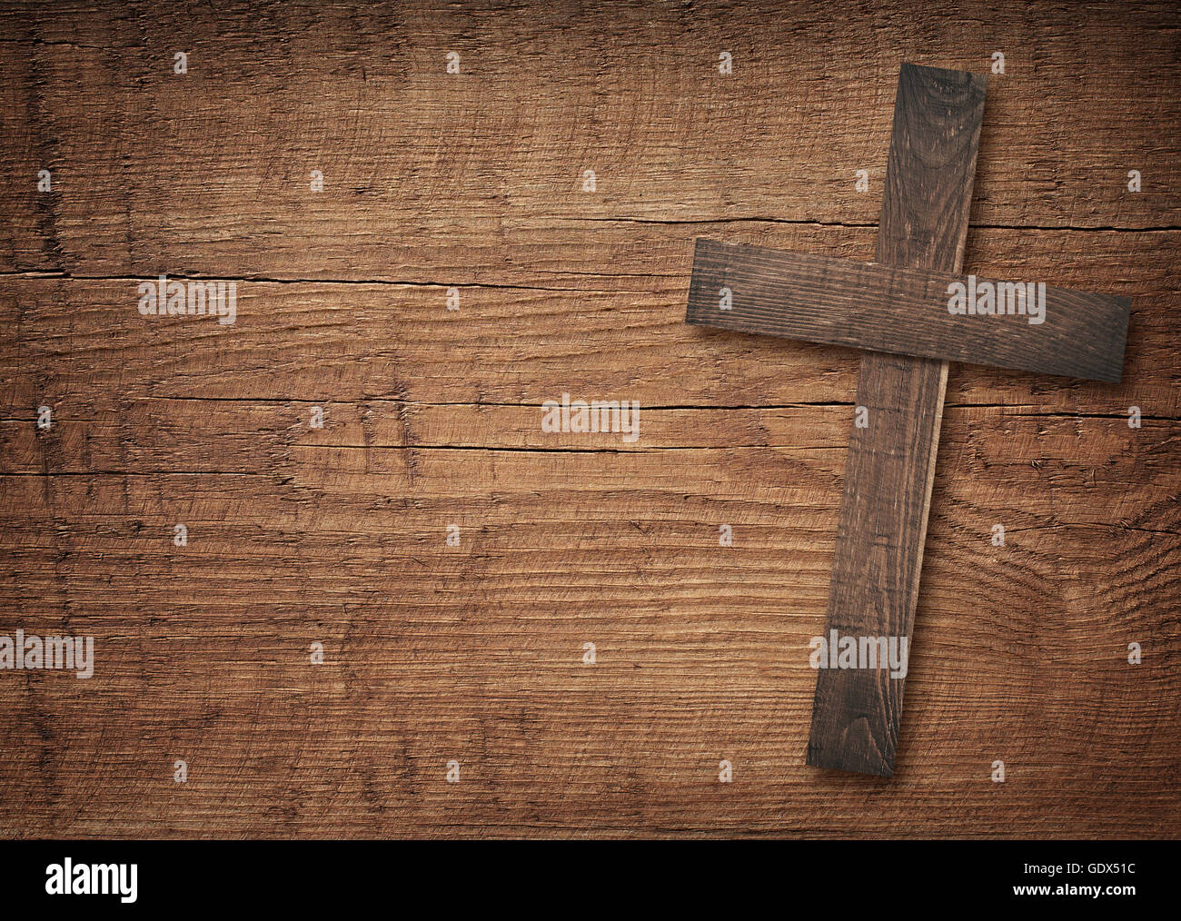 Wooden cross on brown old table top Stock Photo - Alamy