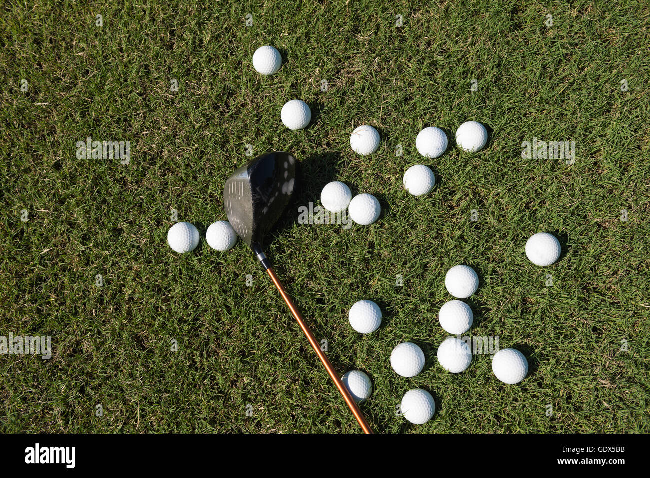 top view flat lay of golf balls with driver on grass background Stock ...