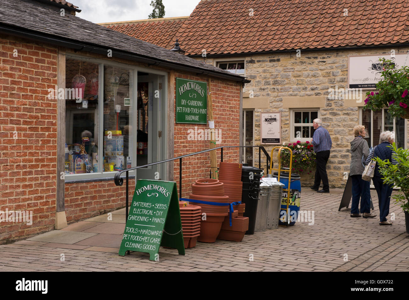 Shoppers passing Homeworks hardware store in the picturesque, historic ...