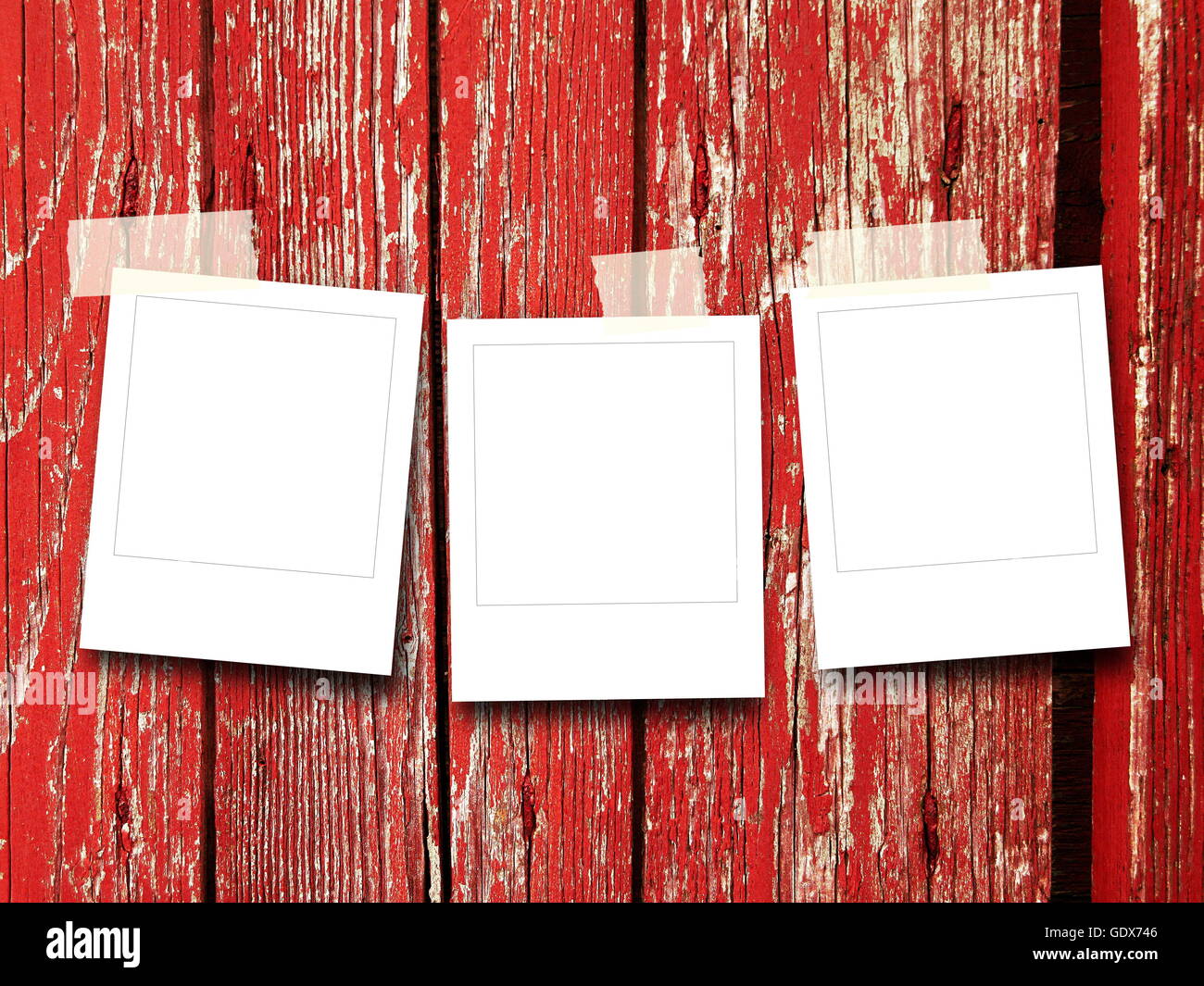Close-up of three blank square instant photo frames with adhesive tape ...