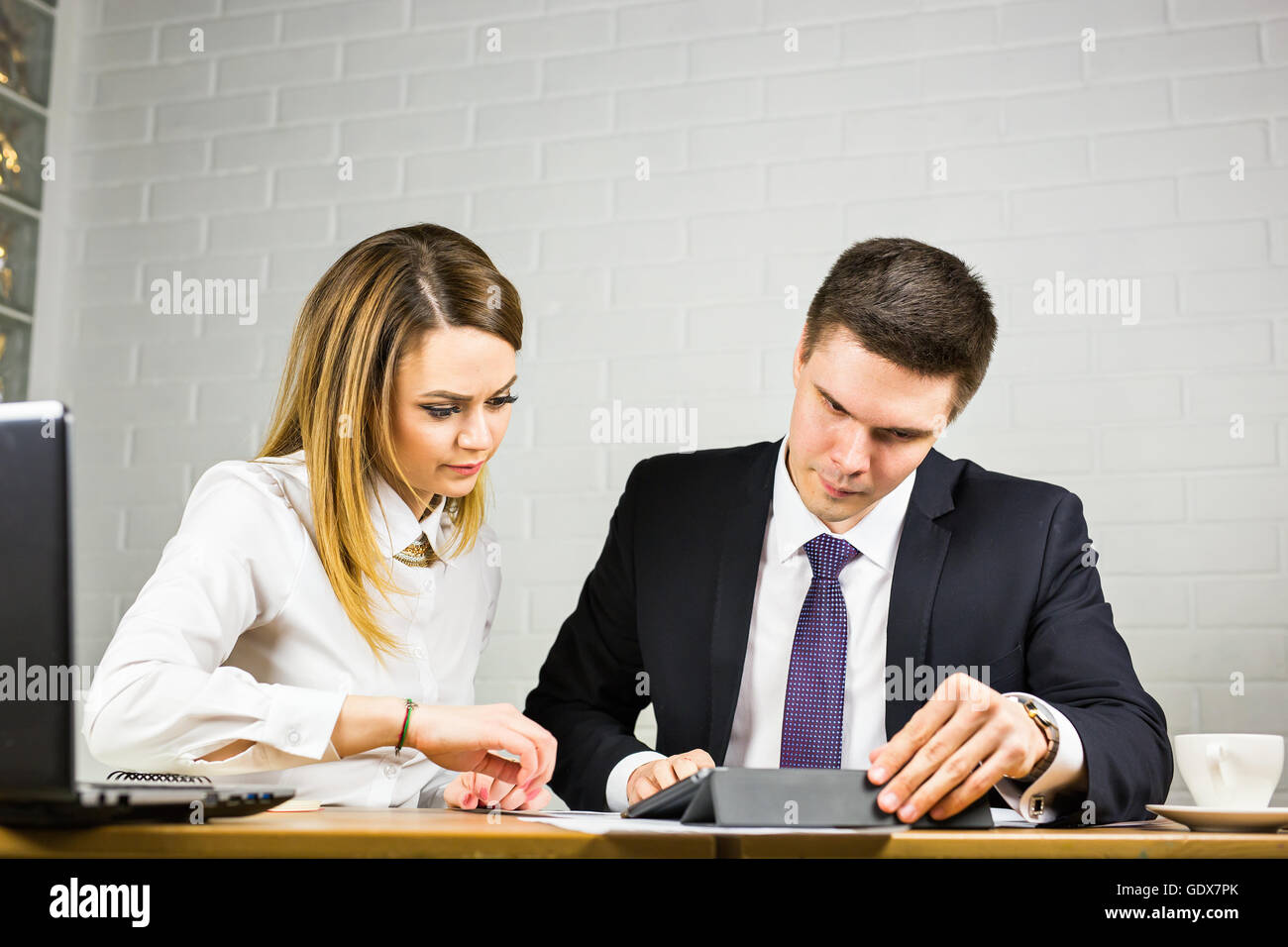 Businesspeople With Digital Tablet Sitting In Modern Office Stock Photo ...