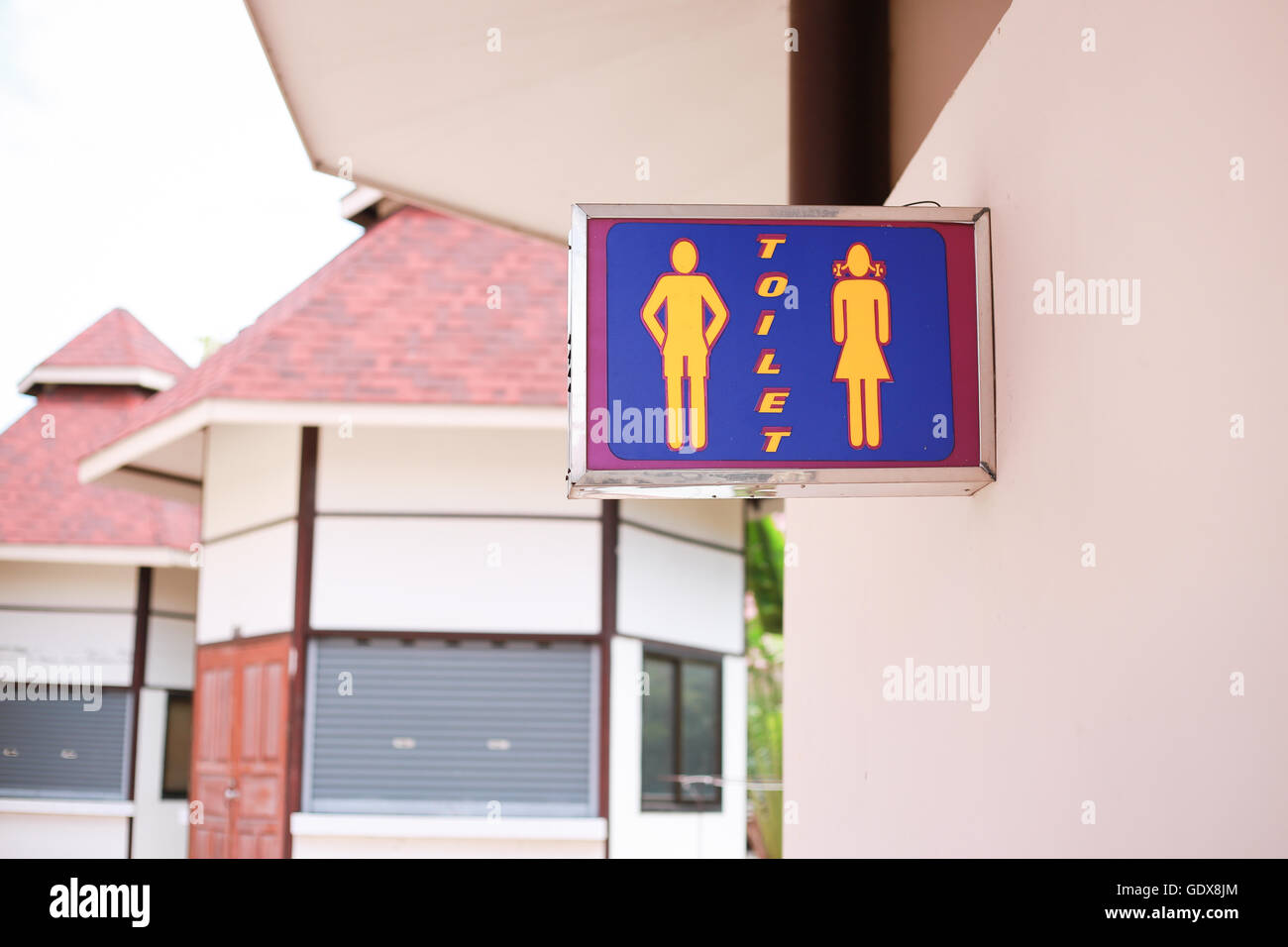 Red toilet sign blue wall hi-res stock photography and images - Alamy