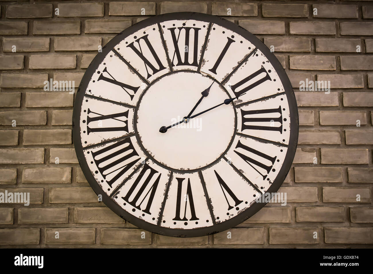 Brick wall with clock hi-res stock photography and images - Alamy
