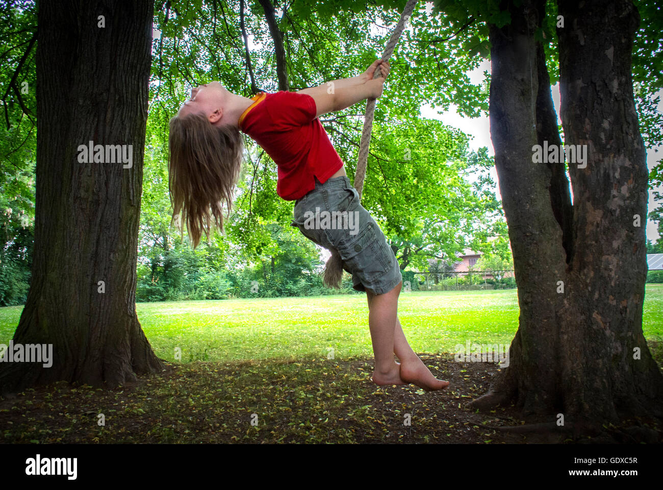 Swinging On A Tree Rope High Resolution Stock Photography and Images ...