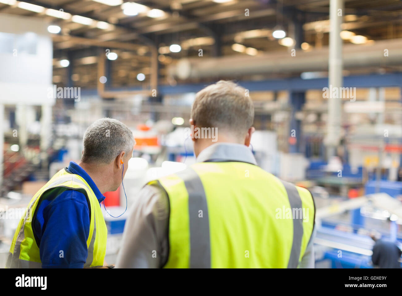 Supervisor and worker in steel factory Stock Photo - Alamy