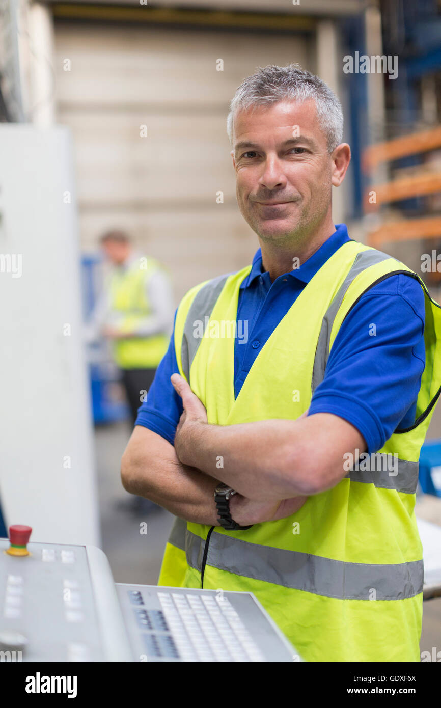 Portrait confident worker at control panel in steel factory Stock Photo ...