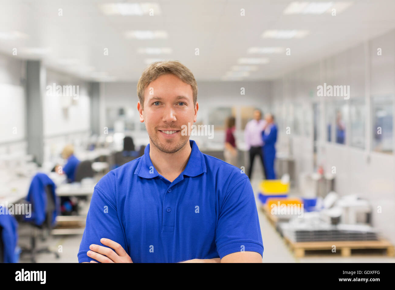 Portrait smiling worker in steel factory office Stock Photo - Alamy