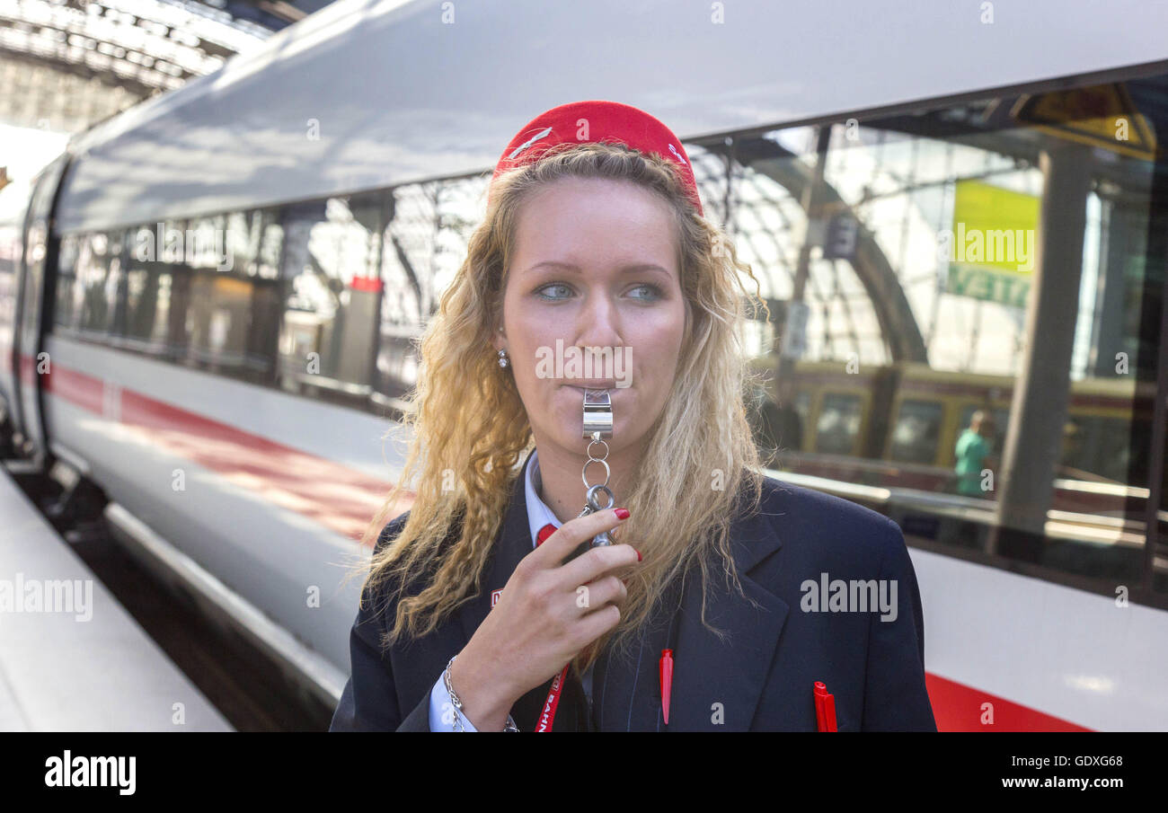 Conductor blowing whistle at platform hi-res stock photography and ...