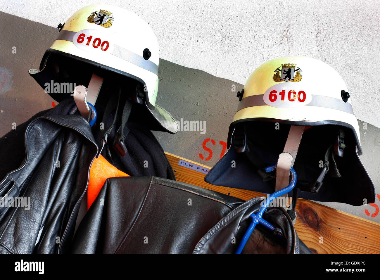 Fire helmets and jackets of firefighters on 03 08 2009 hi-res stock ...