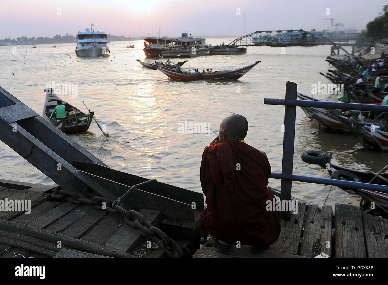 Monk at the Yangon River Stock Photo - Alamy