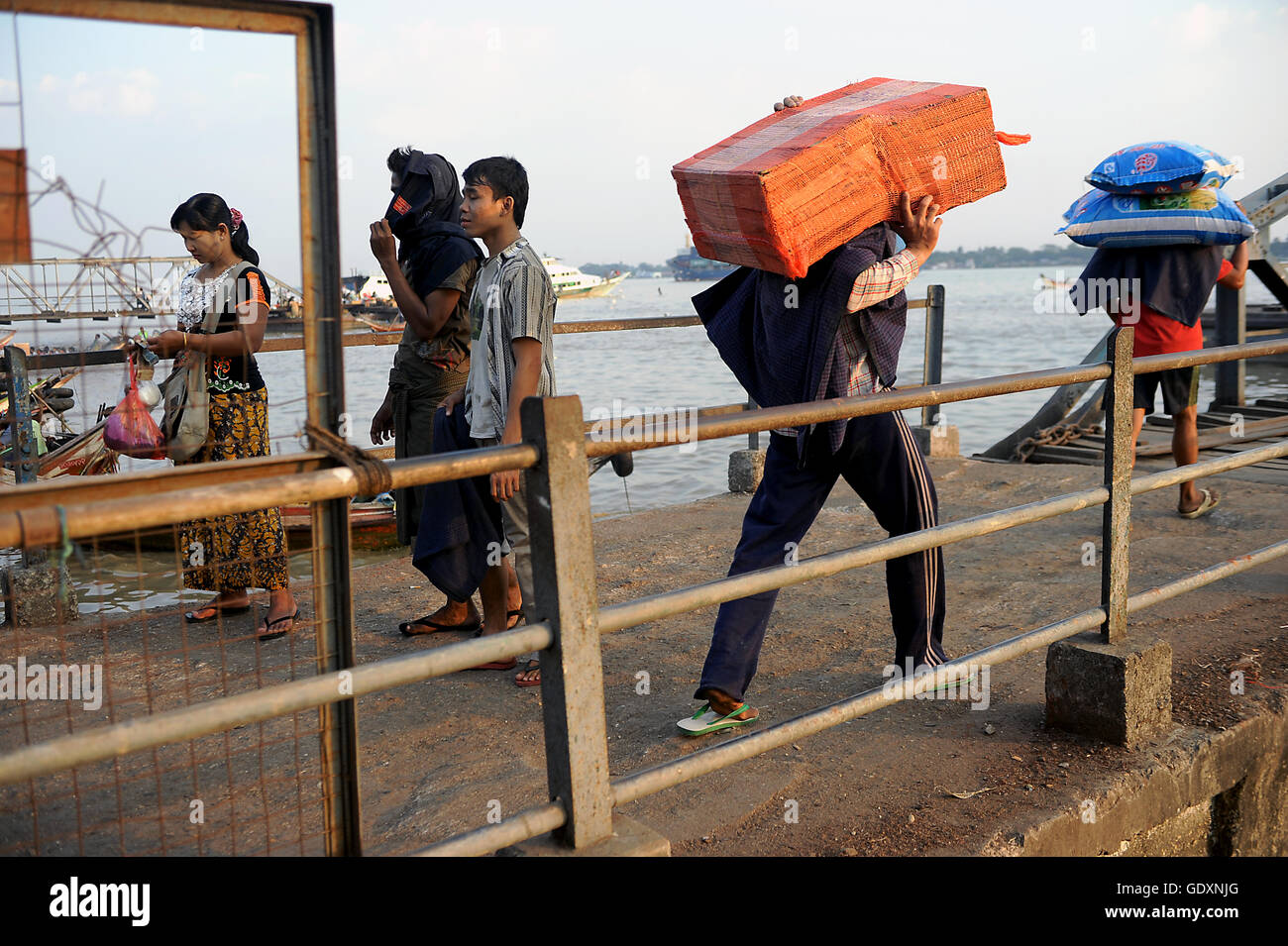 Worker at the jetty Stock Photo - Alamy