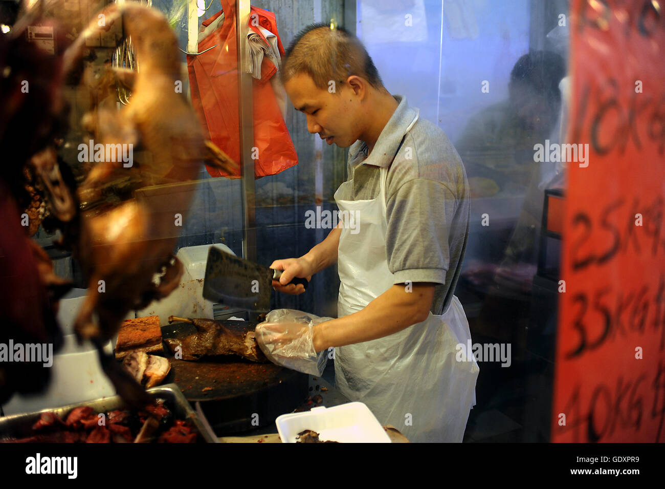 SINGAPORE. 2015. Poultry butcher Stock Photo - Alamy