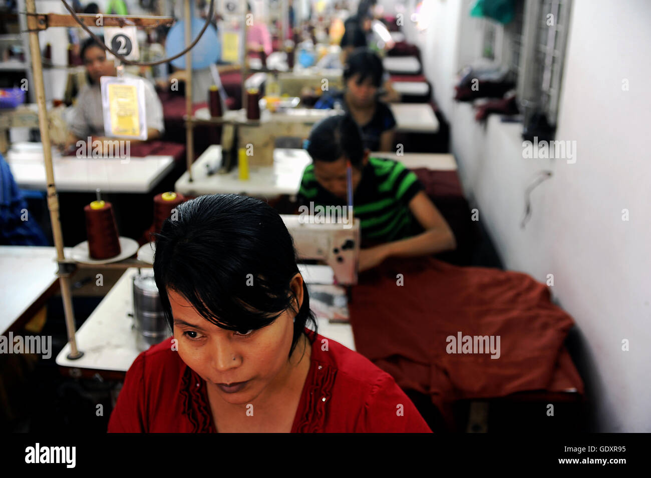 MYANMAR. Yangon. 2014. Portrait of a tailoress Stock Photo - Alamy