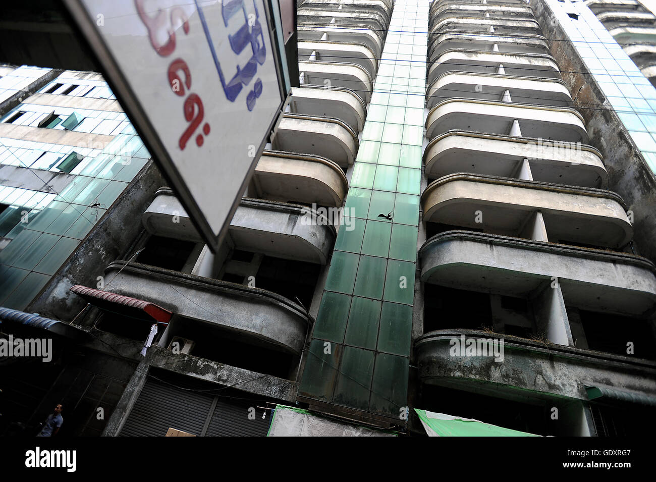 MYANMAR. Yangon. 2014. Abandoned high-rise building Stock Photo - Alamy