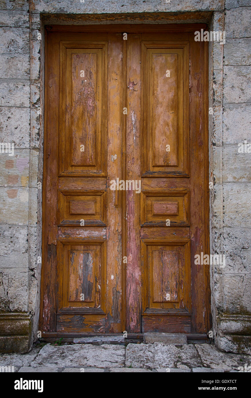 Old worn brown closed door, vertical composition Stock Photo - Alamy