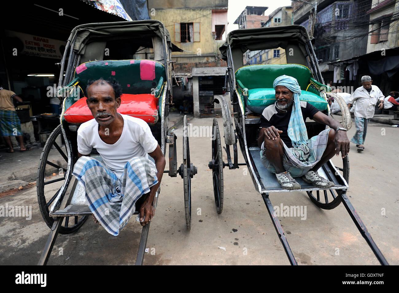 Hand pulled rickshaw pullers hi-res stock photography and images - Alamy