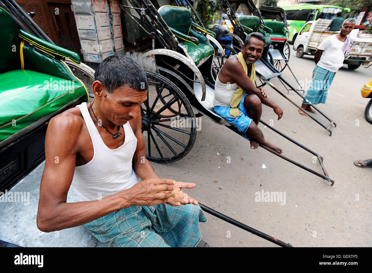 Hand pulled rickshaw pullers hi-res stock photography and images - Alamy