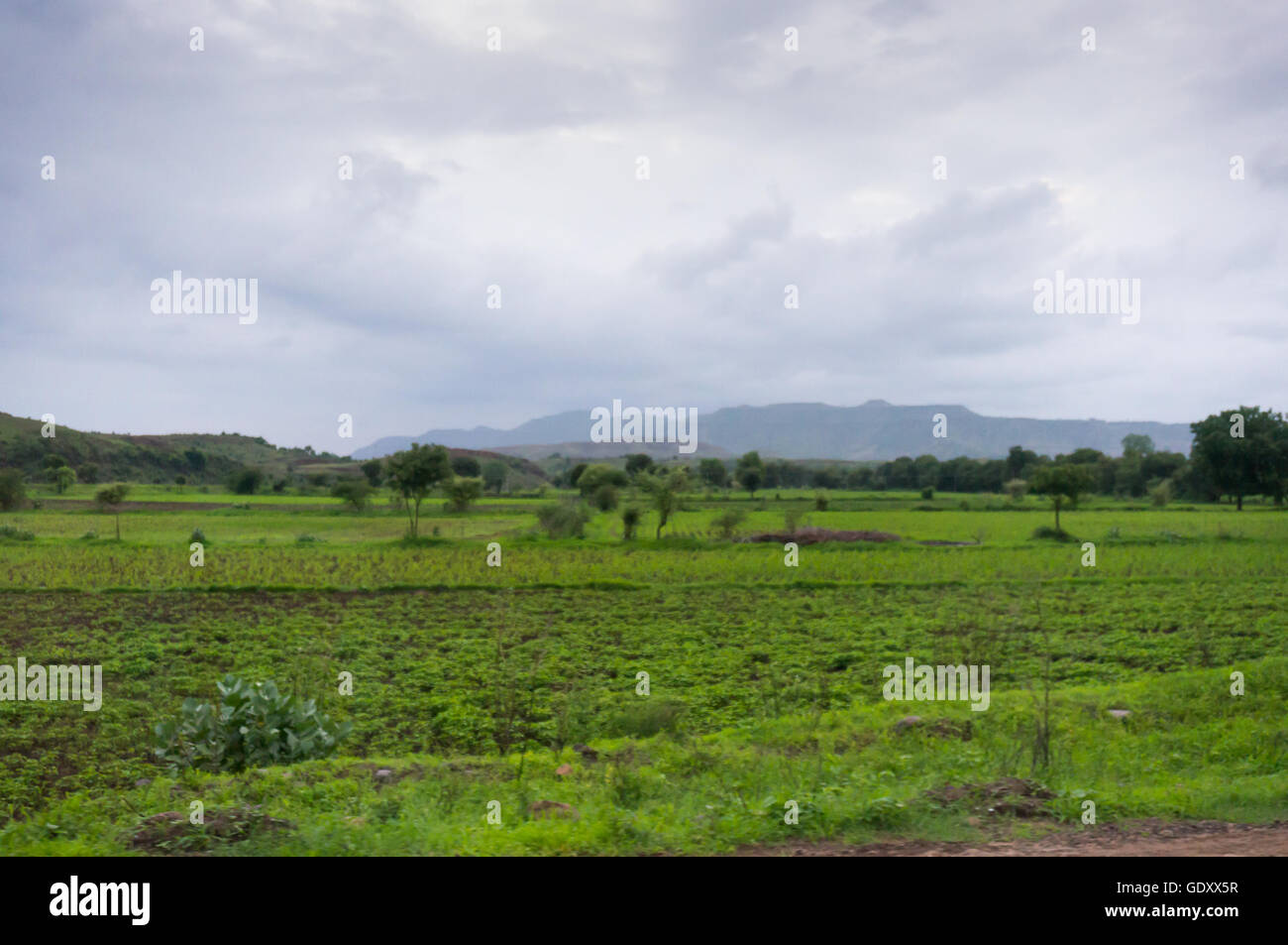 Monsoon clouds over farms and fields in India. Monsoon is the most ...