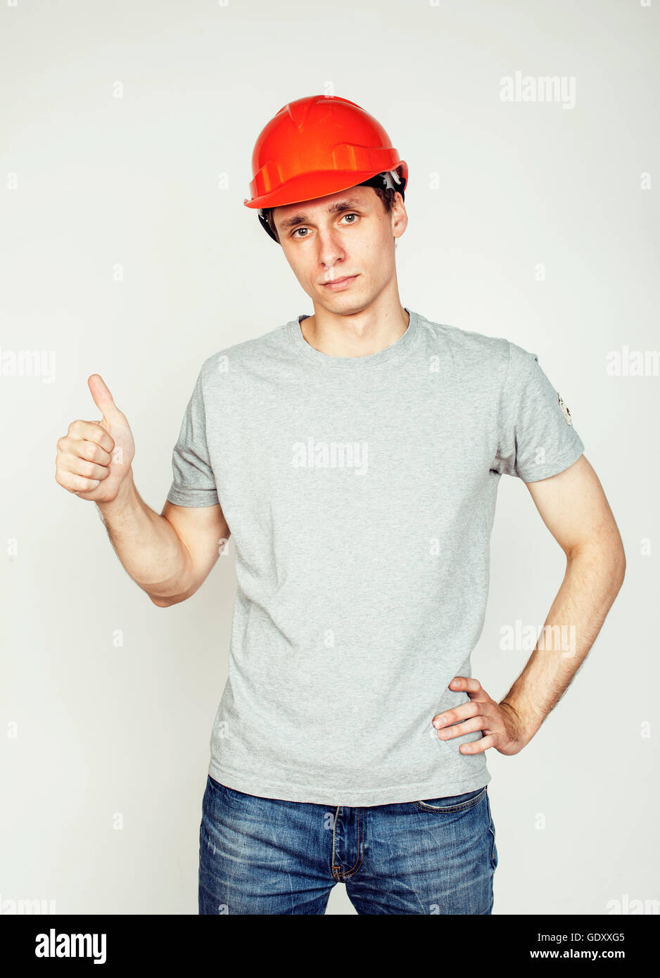 young real hard worker man isolated on white background on ladder ...