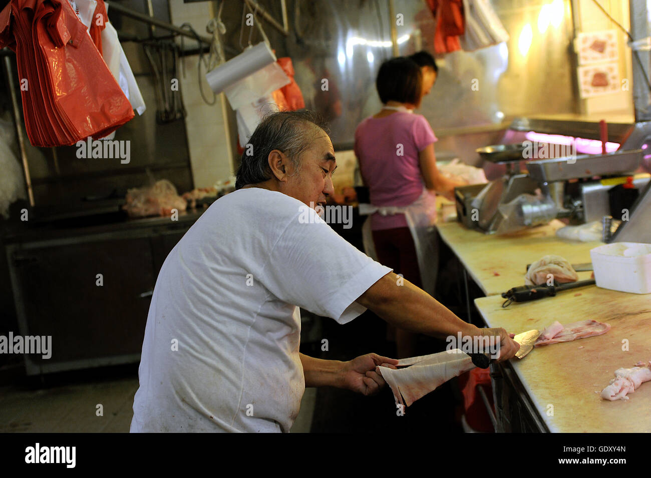 SINGAPORE. 2015. Pork butcher Stock Photo - Alamy