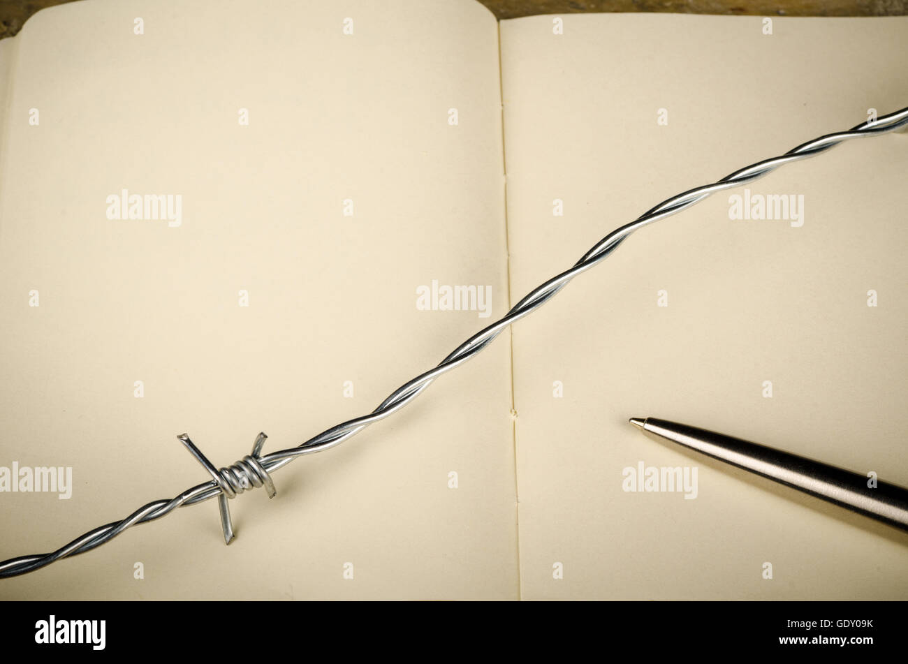 Notebook and pen with barbed wire, a press censorship concept Stock ...