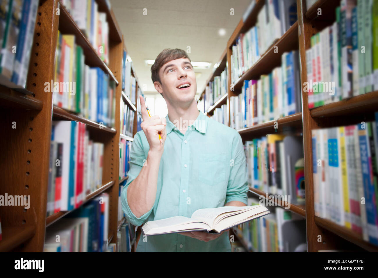 Man holding open book hi-res stock photography and images - Alamy
