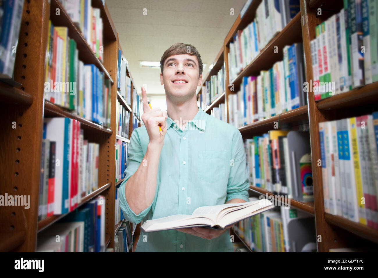 Man holding open book hi-res stock photography and images - Alamy