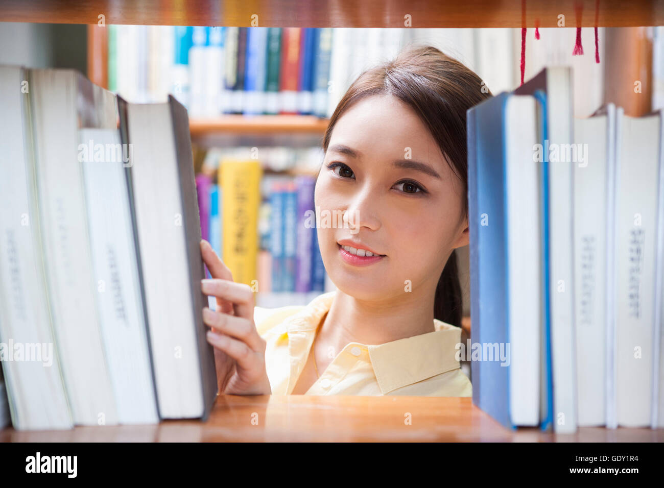 Choosing a book hi-res stock photography and images - Alamy