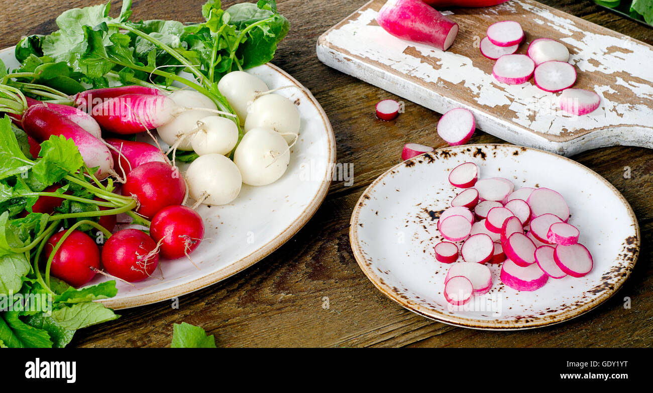 Organic radishes on rustic wooden table. Top view Stock Photo - Alamy