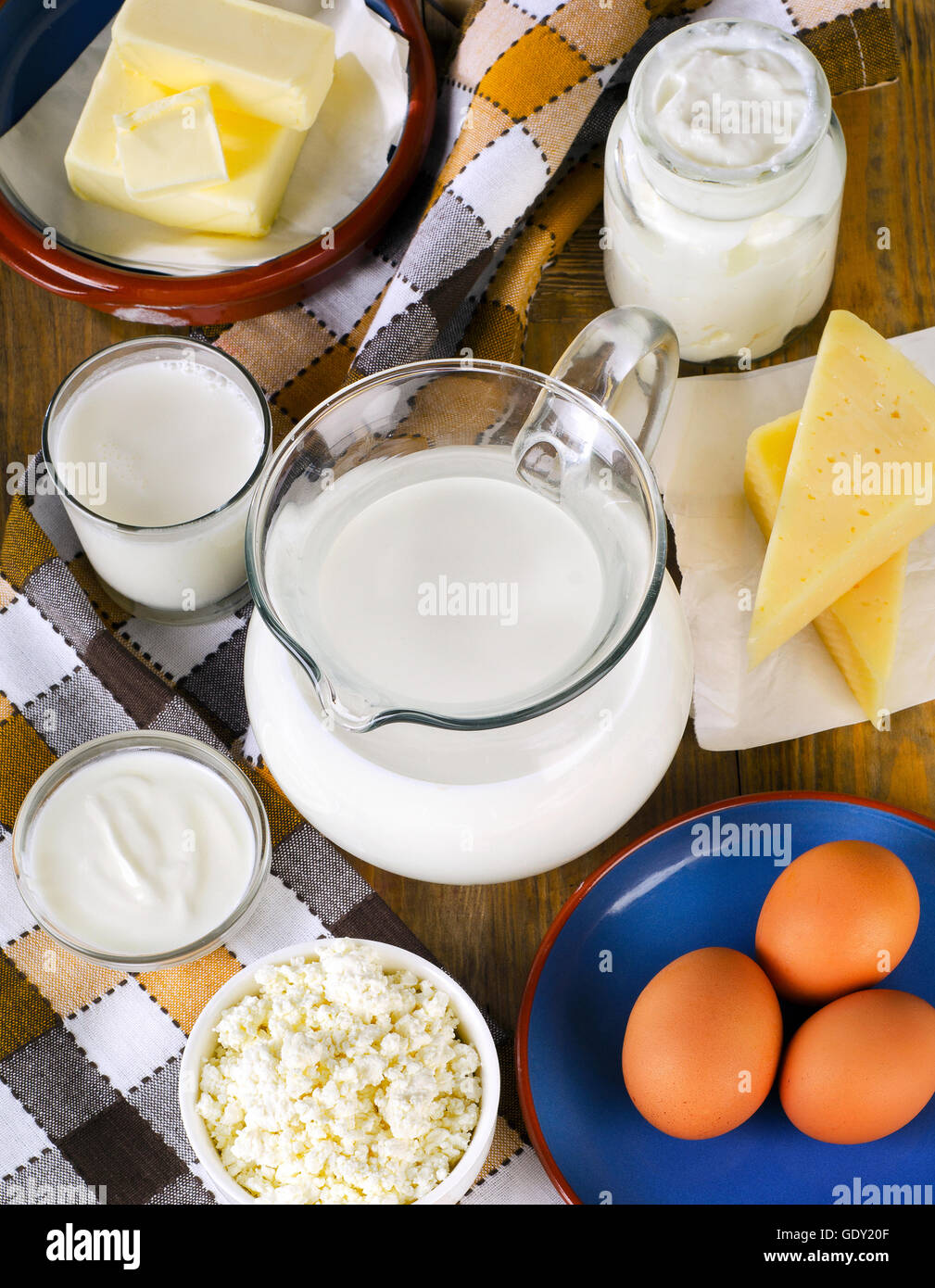 Dairy products on wooden table. Top view Stock Photo - Alamy