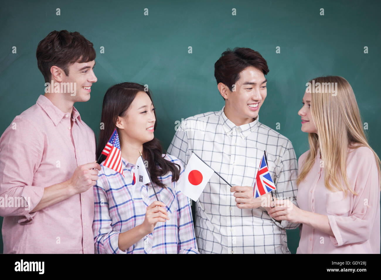 Four smiling global college students face to face Stock Photo - Alamy