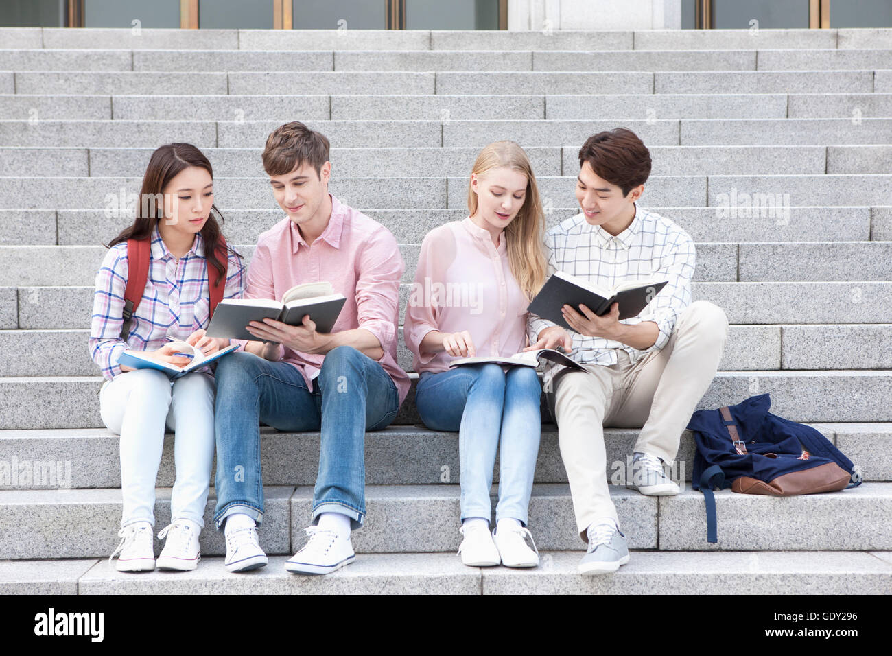 Students sitting down on stairs hi-res stock photography and images - Alamy