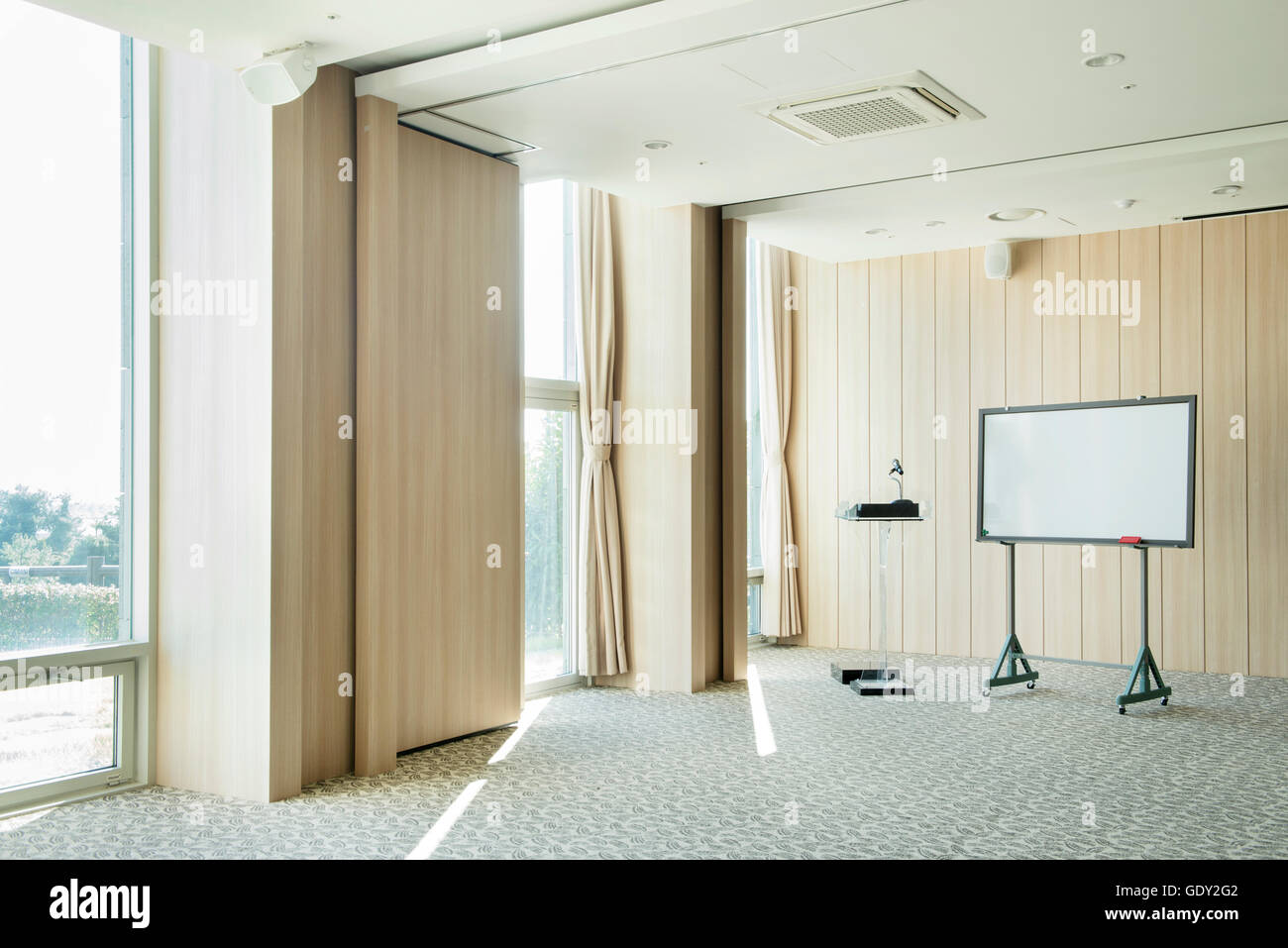 Interior of meeting room with platform and whiteboard Stock Photo - Alamy