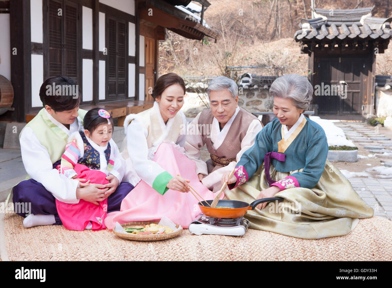 Harmonious big Korean family cooking traditional holiday food Stock ...