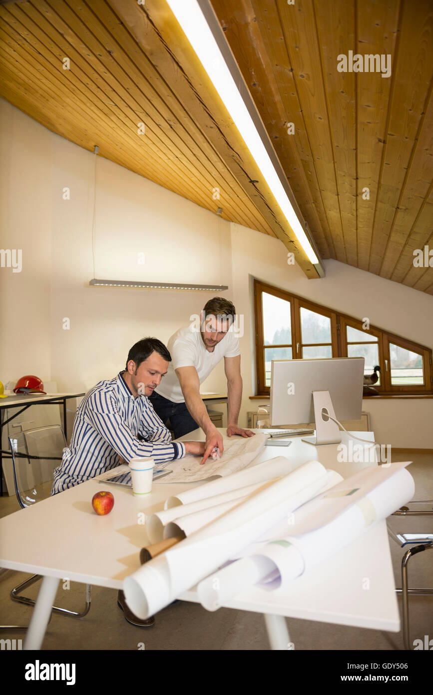 Architects discussing about project in the office, Bavaria, Germany ...