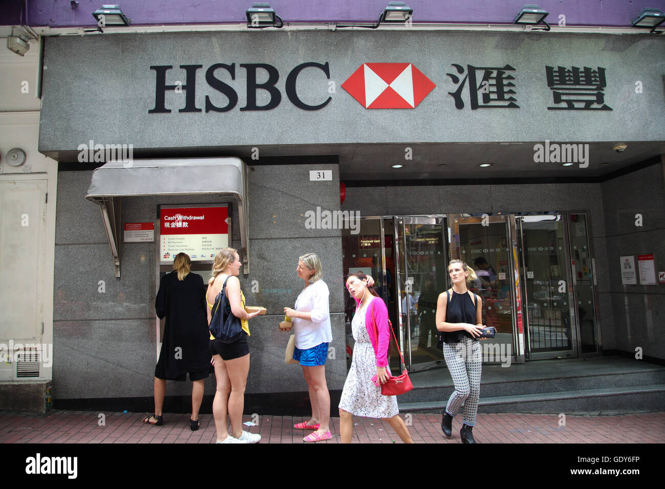 People at cash point outside HSBC bank in Hong Kong, China, Asia Stock ...