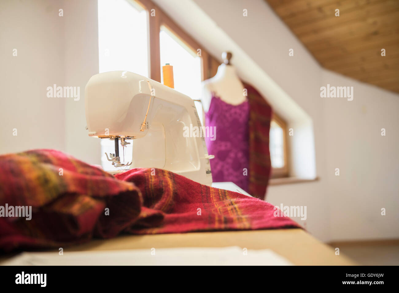 Sewing machine with clothes in clothes shop, Bavaria, Germany Stock ...