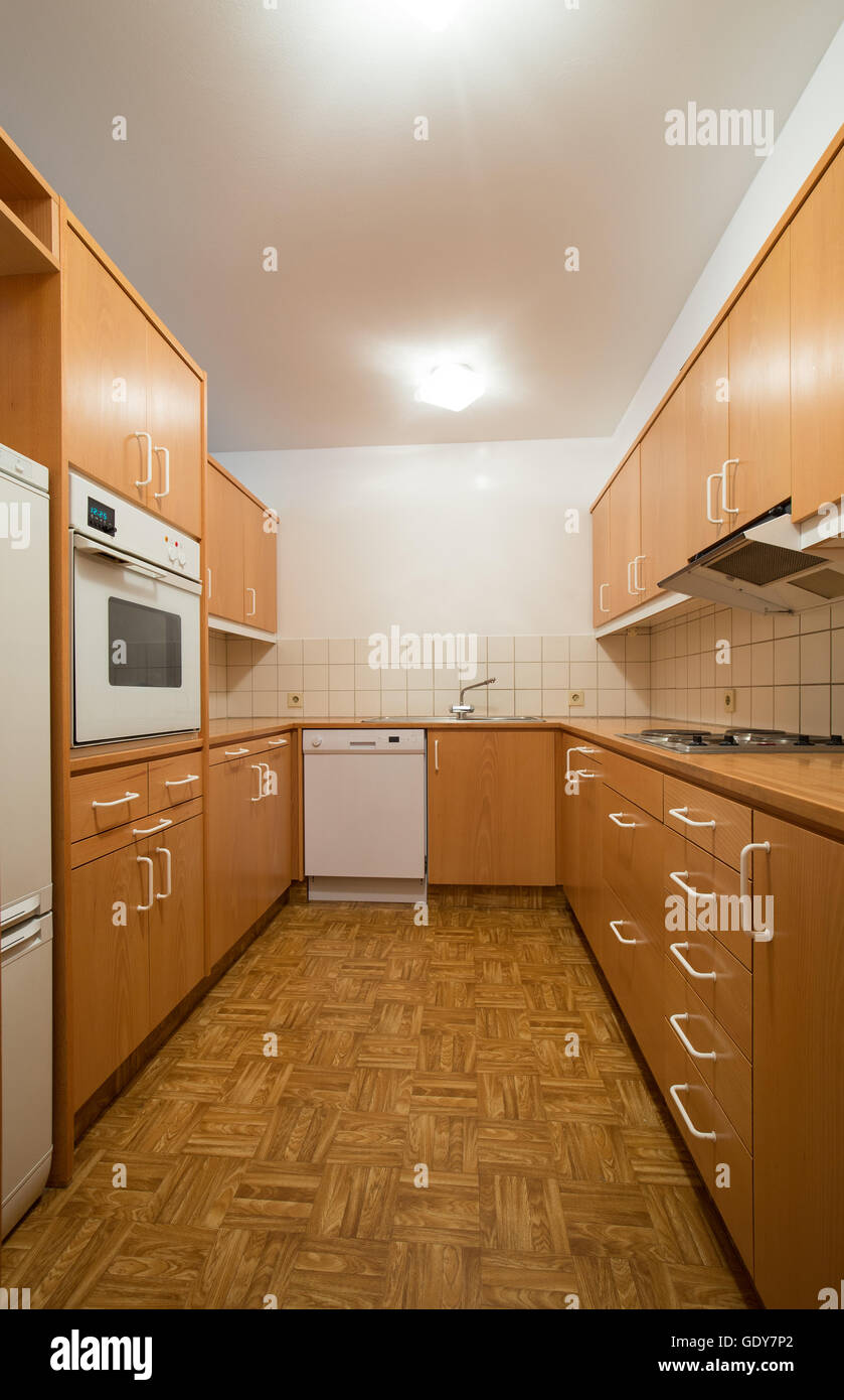 Small empty kitchen in a small apartment Stock Photo - Alamy