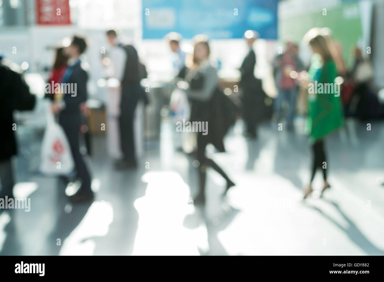 Out of focus shot of people walking past on their errands Stock Photo ...