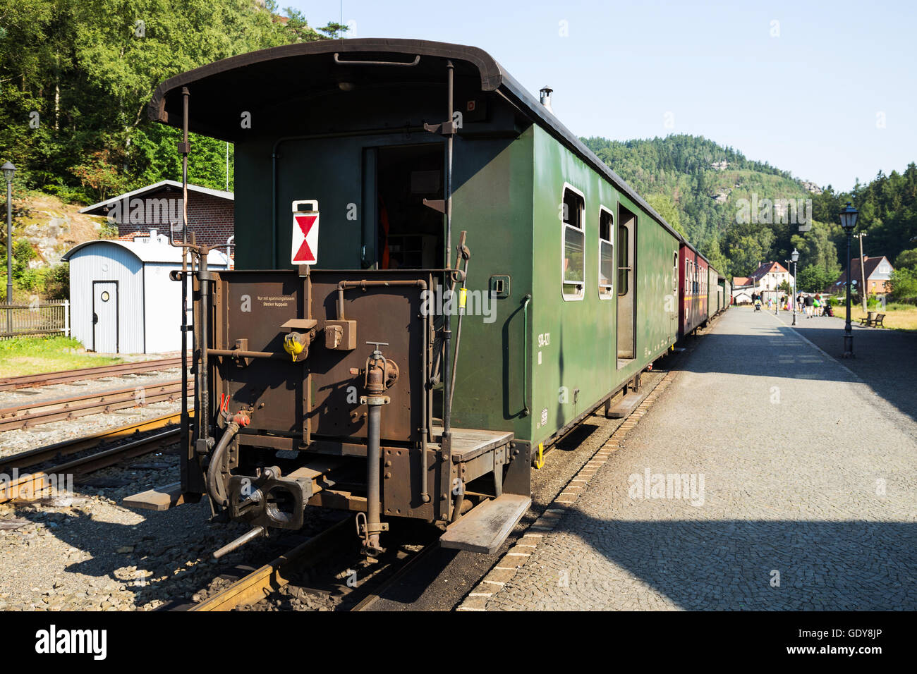 A shot of an old passenger train about to depart from a small town ...