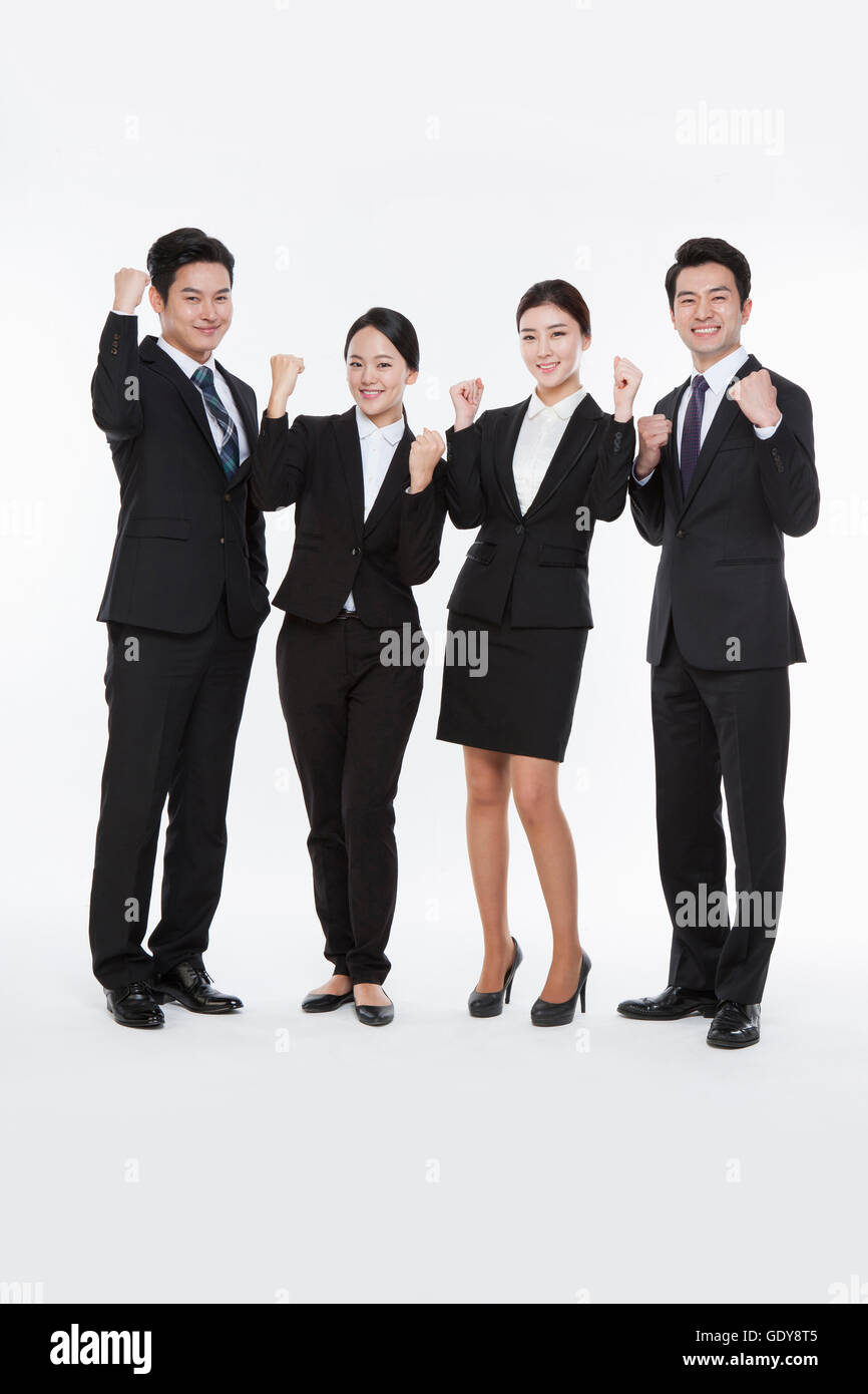 Four business people standing together hi-res stock photography and ...