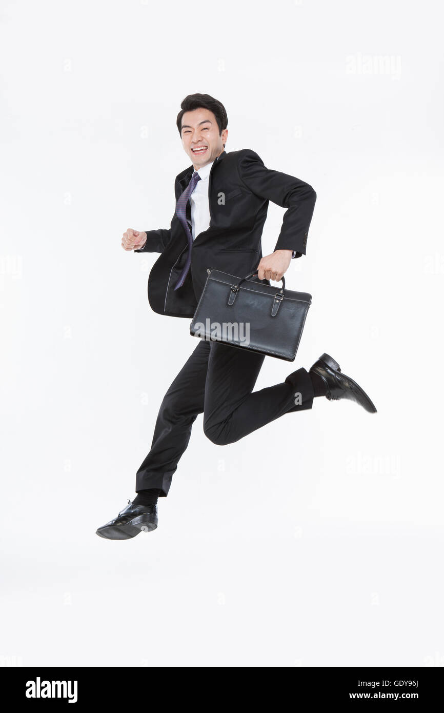 Man in suit running hi-res stock photography and images - Alamy