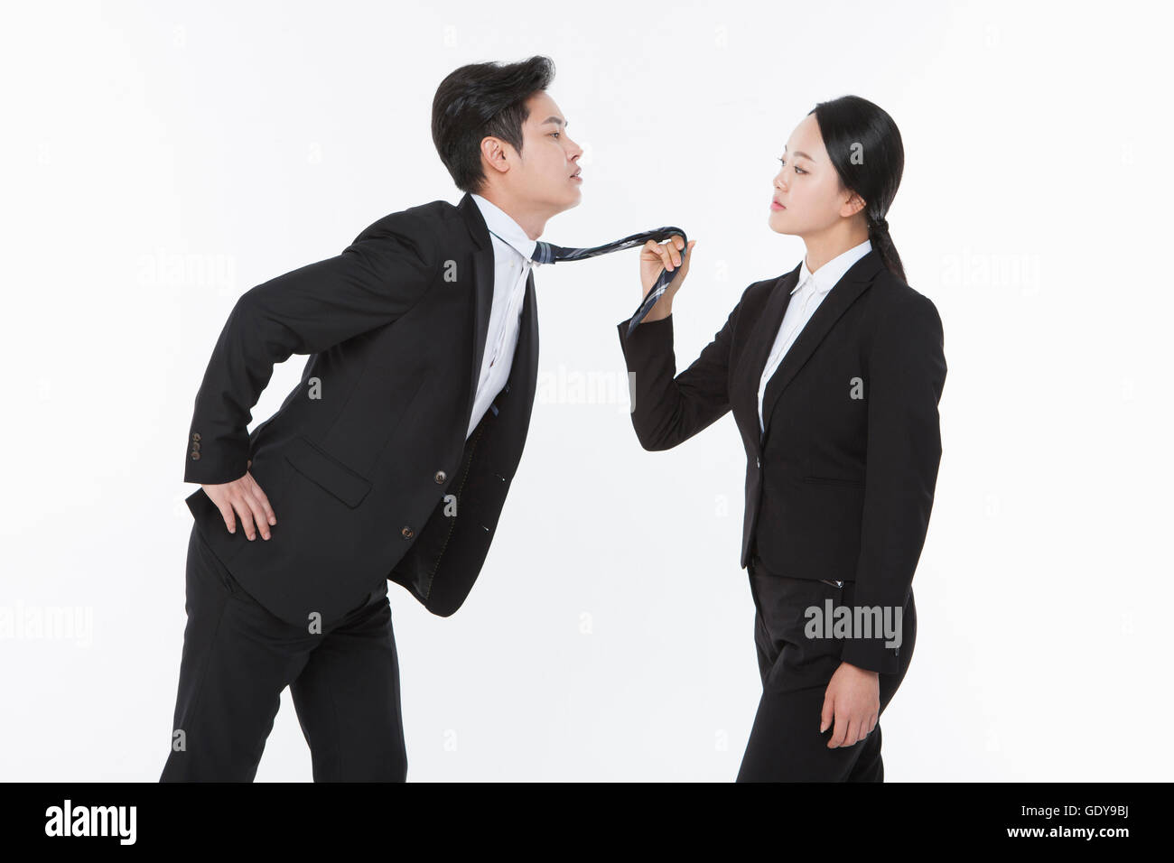 Woman pulling mans tie hi-res stock photography and images - Alamy