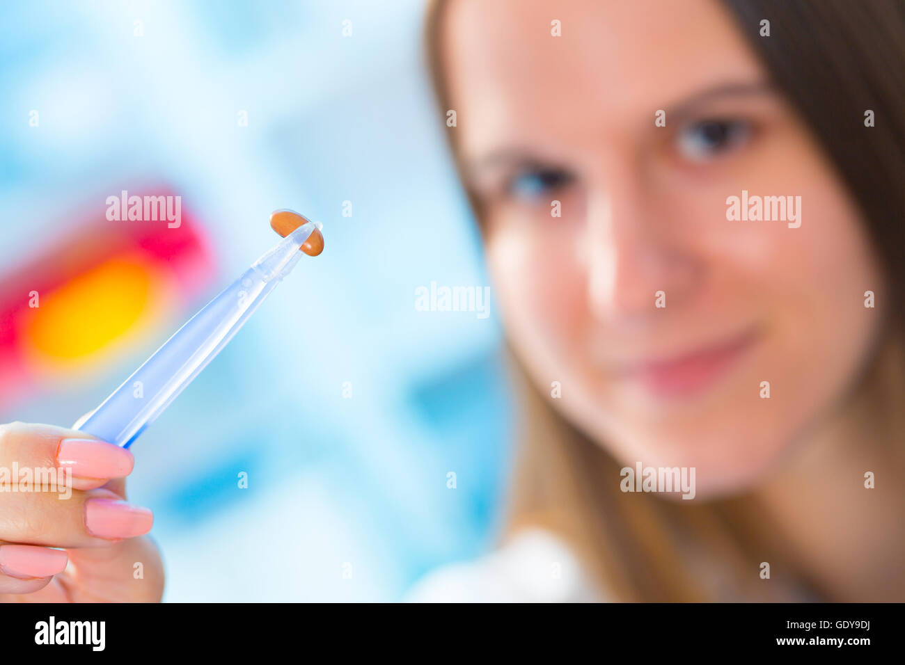 Laboratory assistant holding with forceps beans grain Stock Photo - Alamy