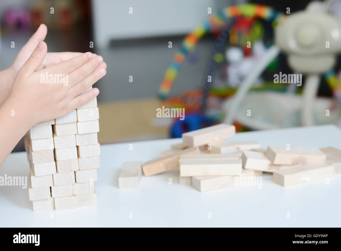 Child hands playing with wooden blocks Stock Photo - Alamy