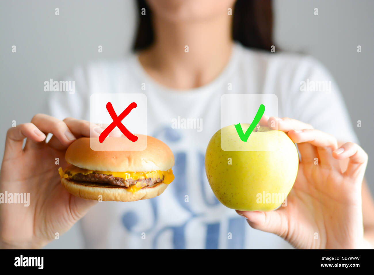 Choose between junk food versus healthy diet Stock Photo - Alamy